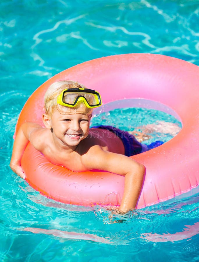 Young Kid Having Fun in Swimming Pool Stock Photo - Image of inflatable ...