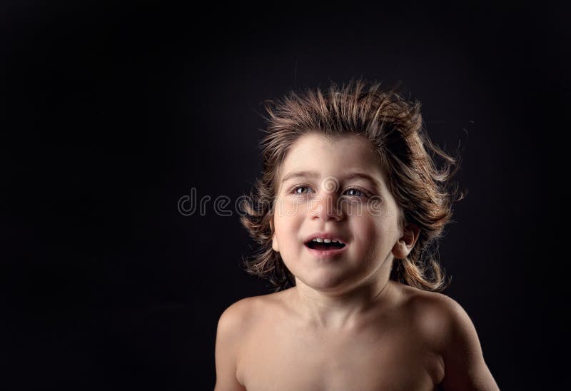 Young Kid with Humor Expression and Flying Hair Stock Image - Image of ...