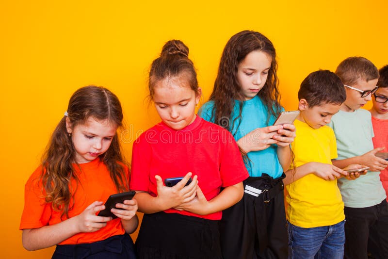 Young Kids Playing Game on Mobile Phone Stock Photo - Image of cute ...