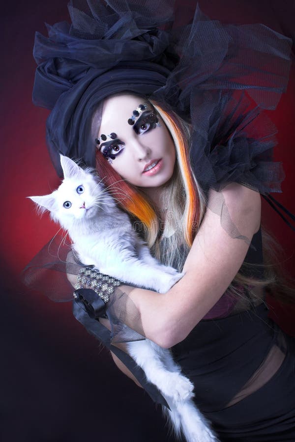 Young lady with cat. stock image. Image of devil, mysterious - 53744547