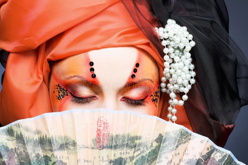 Young lady with fan stock image. Image of makeup, orange - 37786821