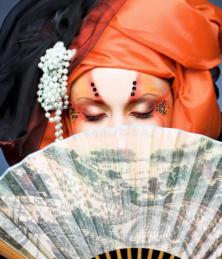 Young lady with fan stock photo. Image of beauty, beads - 37909804