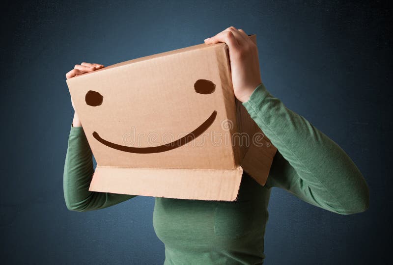 Young Lady Gesturing with a Cardboard Box on Her Head with Smile Stock ...