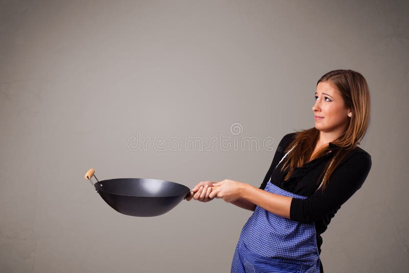Young Lady Holding a Frying Pan Stock Photo - Image of girl, beauty ...