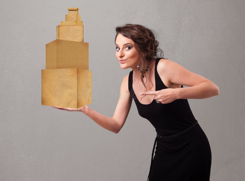 Young Lady Holding a Set of Brown Cardboard Boxes Stock Image - Image ...