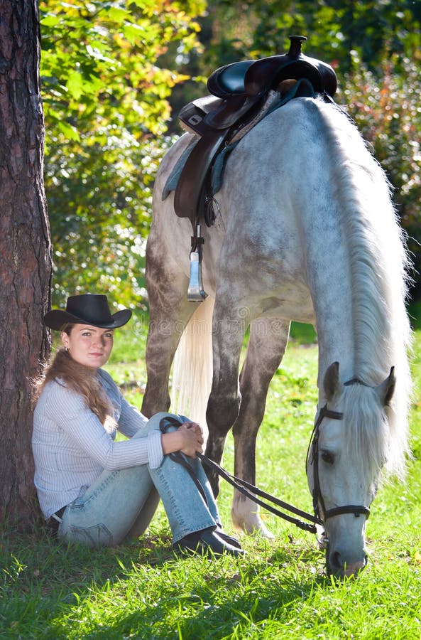 Young Lady riding a horse stock photo. Image of beauty - 16396262
