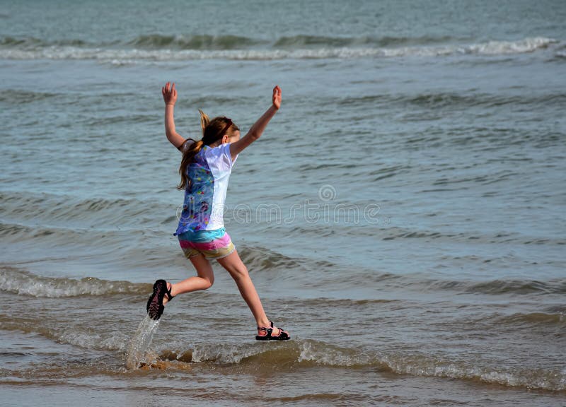 Young Lady Jumping into Waves Stock Photo - Image of teen, waves: 186425880