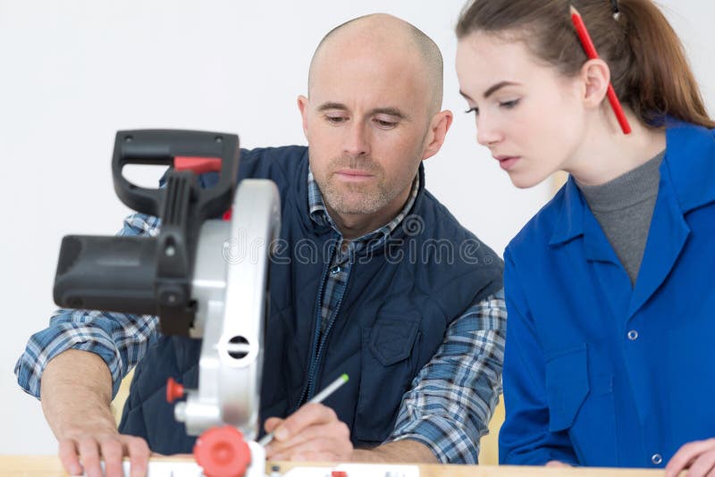 Young Lady Learning To Use Chopsaw Stock Photo - Image of occupation ...