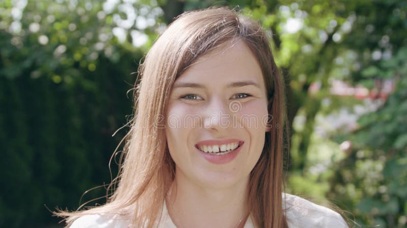 Young Lady Looking at the Camera and Smiling Stock Photo - Image of ...