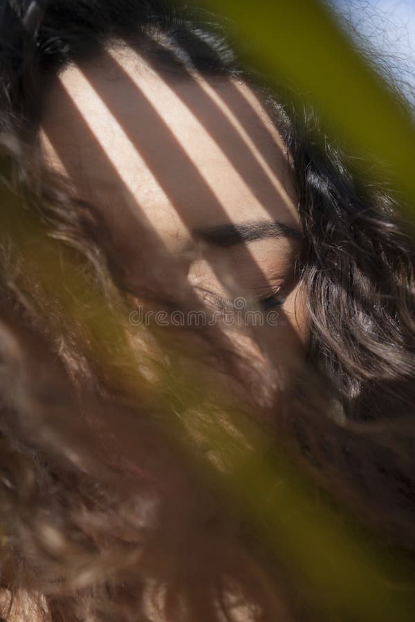 Young lady one eye closed stock photo. Image of green - 68756476