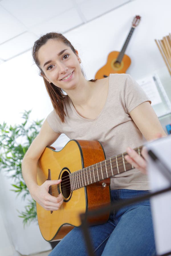 Young Lady Playing Acoustic Guitar Stock Image - Image of guitarist ...