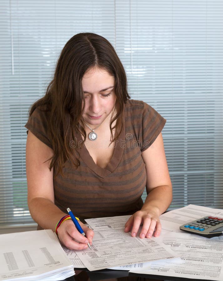 Young Lady Preparing USA Tax Form 1040 for 2012 Stock Photo - Image of ...