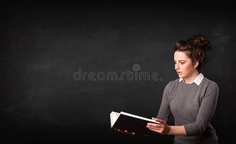 Young lady reading a book stock image. Image of people - 58482127