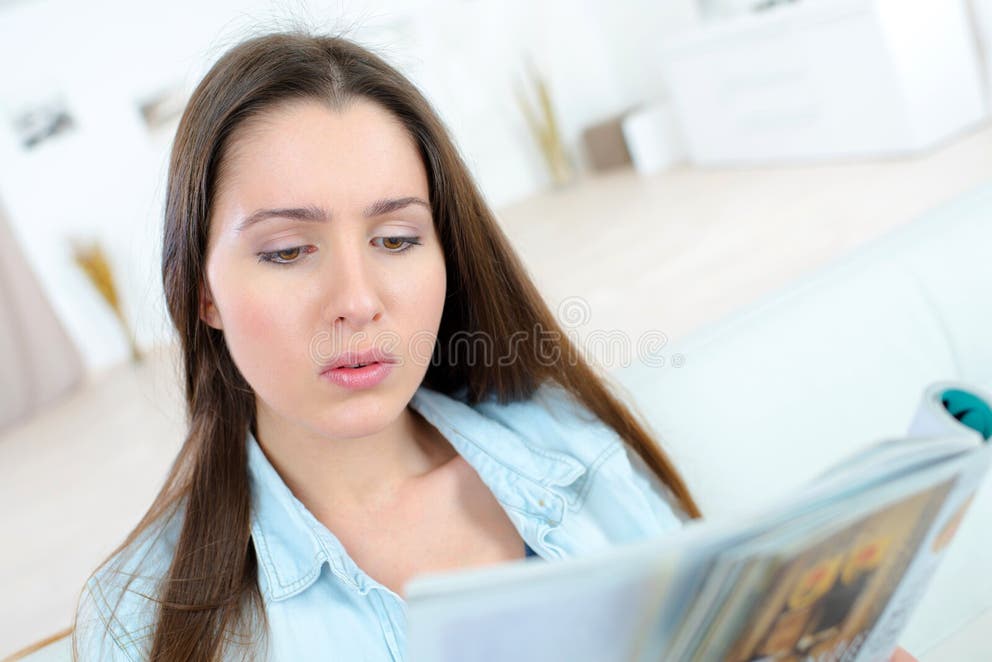 Young Lady Reading Magazine Stock Image - Image of face, unsmiling ...