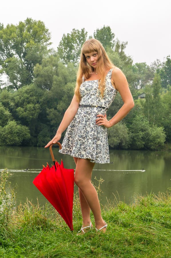 Young Lady with Red Umbrella Near the Pond Stock Image - Image of ...