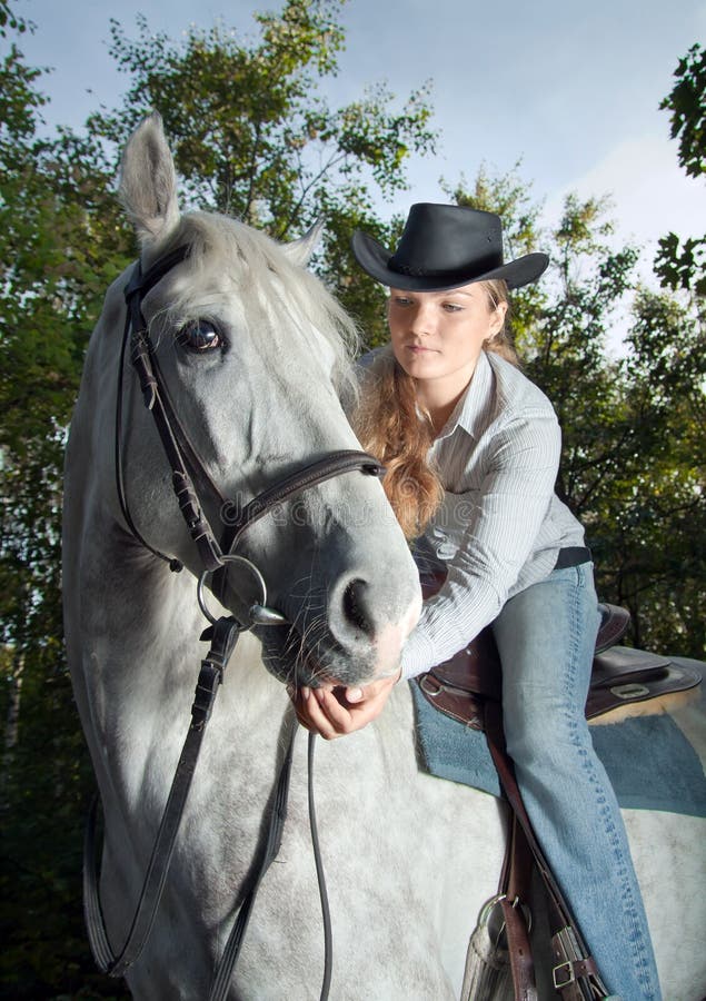 Young Lady riding a horse stock image. Image of woman - 16617697
