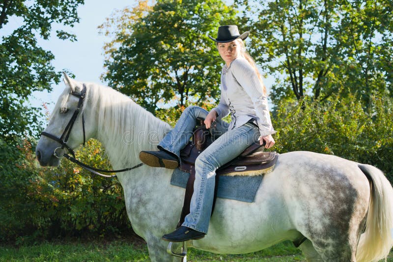 Young Lady riding a horse stock photo. Image of hugging - 17443134