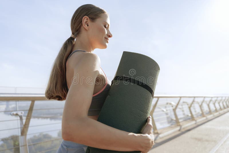 Young Lady with Roll Mat on Foot Bridge Stock Image - Image of ready ...