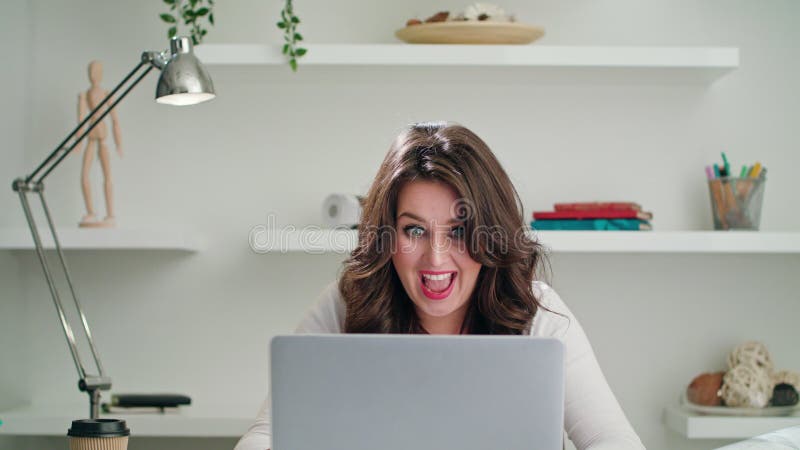 A Young Lady Using a Computer Indoors Stock Photo - Image of clapping ...