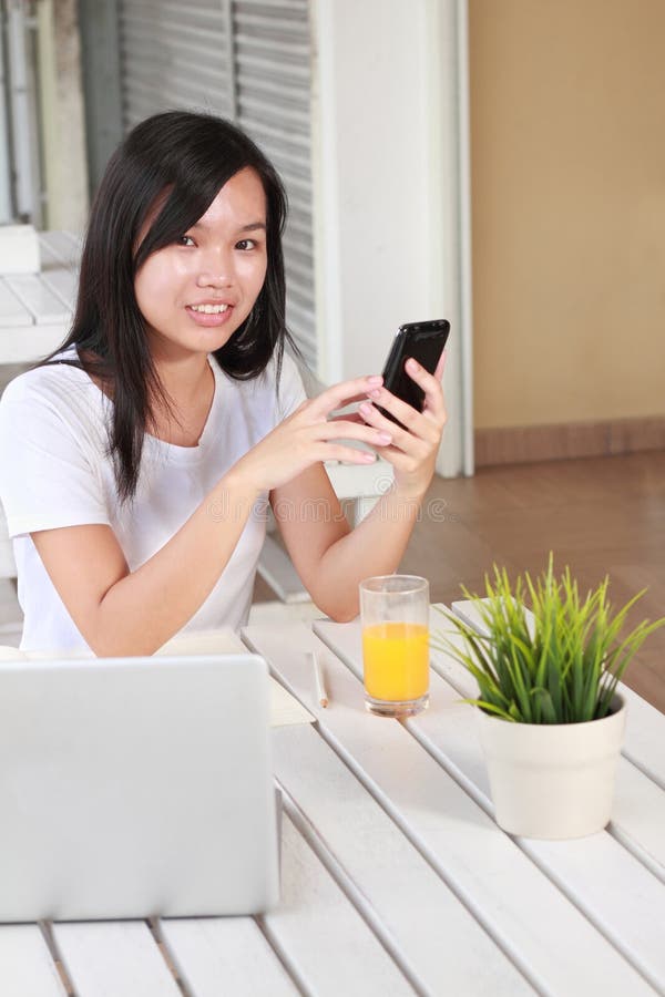 Young lady with Smartphone stock image. Image of female - 32378185