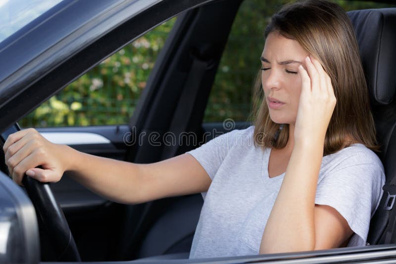Young Lady Suffering with Headache while Driving Car Stock Image ...