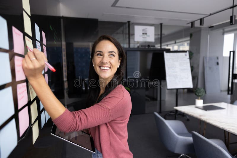 Young Lady Taking Notes on Glass Scrum Board from Tablet Stock Image ...