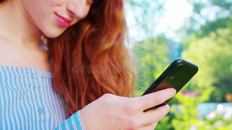 Lady Using a Phone Outdoors Stock Image - Image of mobile, internet ...