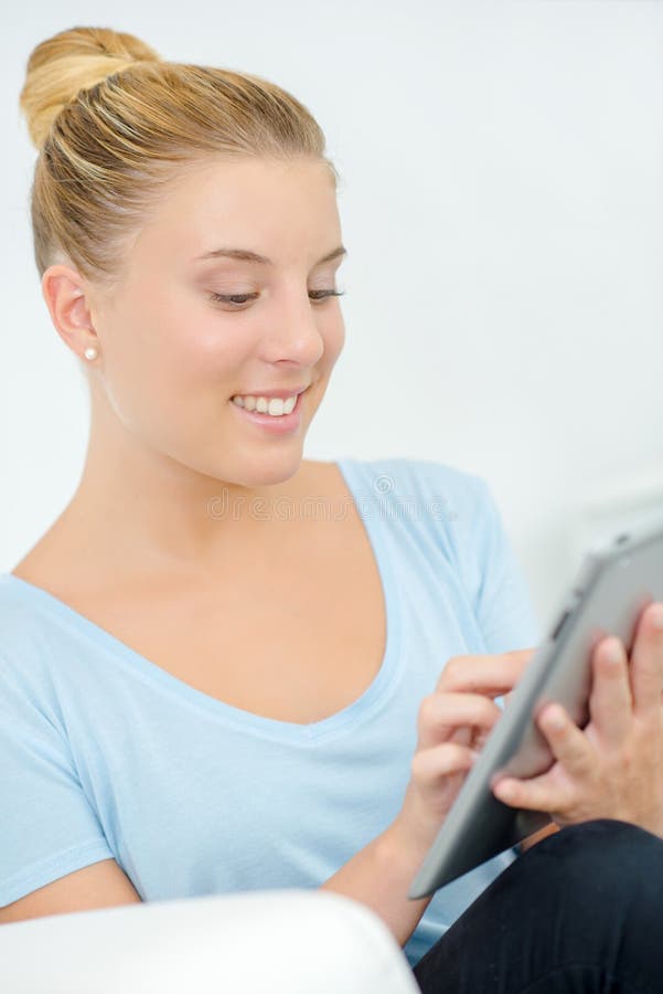 Young lady using tablet stock image. Image of touchscreen - 127171025