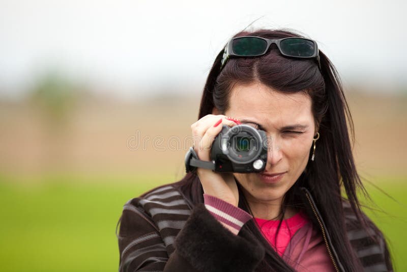 Young Lady Using Video Camera Outdoors Stock Photo - Image of green ...