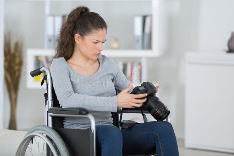 Young Lady in Wheelchair Looking at Camera Display Screen Stock Photo ...
