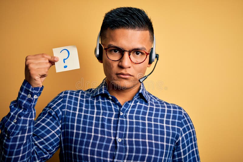 Young Latin Call Center Agent Man Holding Question Mark Reminder Paper ...