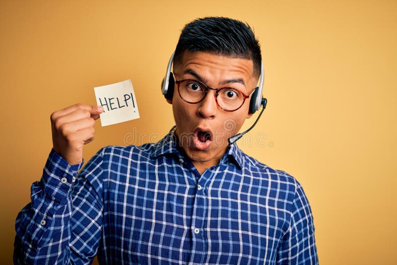 Young Latin Call Center Agent Man Overworked Holding Help Message Paper ...