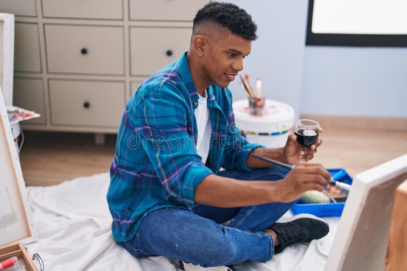 Young Latin Man Artist Drinking Wine Drawing at Art Studio Stock Photo ...