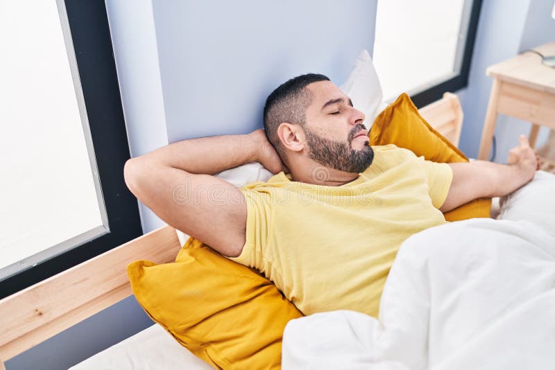 Young Latin Man Lying on Bed Sleeping at Bedroom Stock Photo - Image of ...