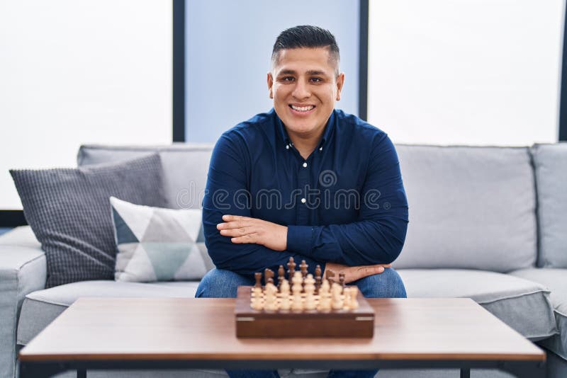 Young Latin Man Playing Chess Sitting on Sofa at Home Stock Photo - Image of happy, enjoy: 266517354