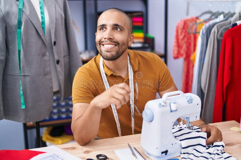 Young Latin Man Tailor Smiling Confident Using Sewing Machine at ...