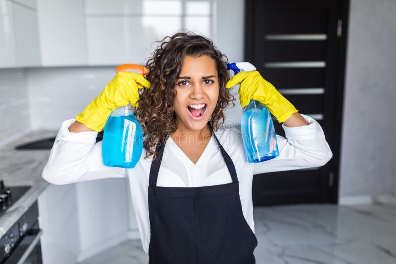 Young Latin Woman is Having Fun while Doing Cleaning at Home Stock ...