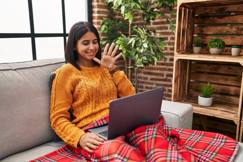 Young Latin Woman Having Video Call Using Deaf Sign Language at Home ...