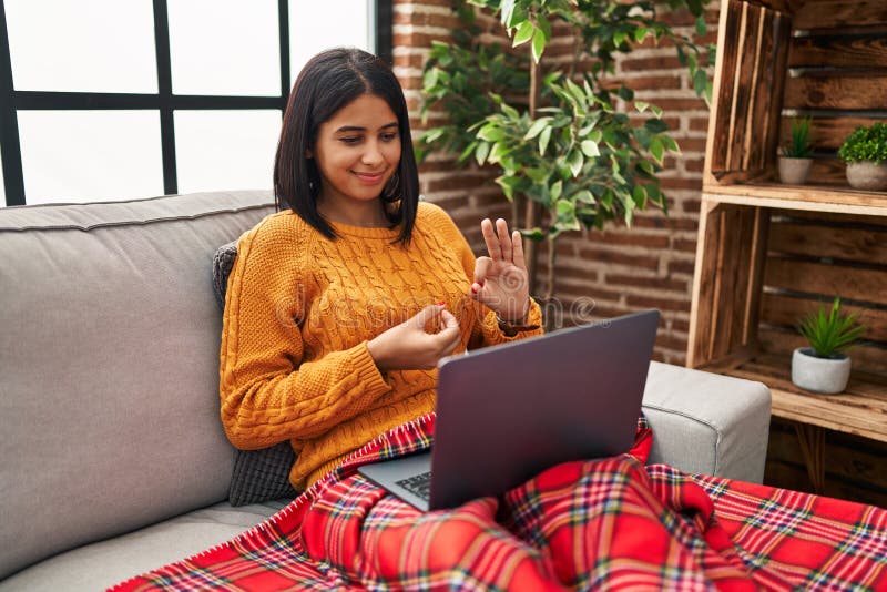 Young Latin Woman Having Video Call Using Deaf Sign Language at Home ...