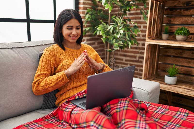 Young Latin Woman Having Video Call Using Deaf Sign Language at Home ...