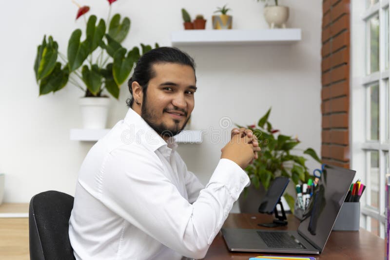 Young Latino Man Working at Home in a Desk Stock Image - Image of ...