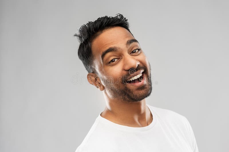 Young Laughing Indian Man Over Gray Background Stock Image - Image of ...