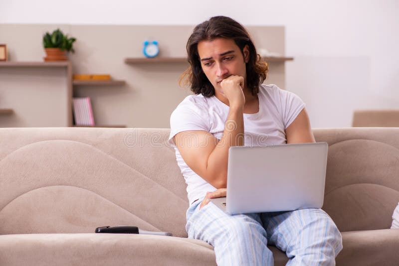 Young Lazy Man in Oversleeping Concept at Home Stock Image - Image of ...
