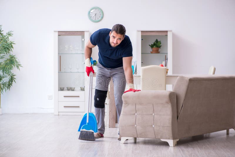 Young Leg Injured Contractor Cleaning the House Stock Photo - Image of ...