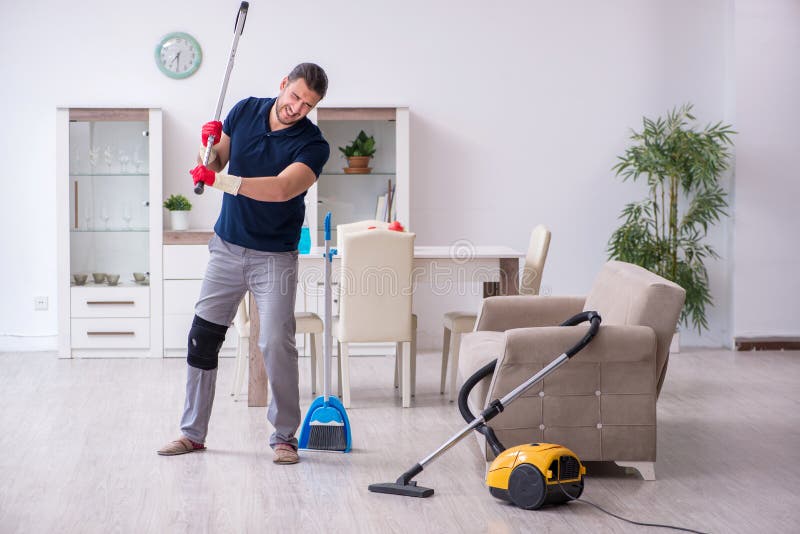 Young Leg Injured Contractor Cleaning the House Stock Photo - Image of ...