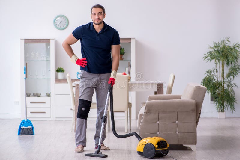 Young Leg Injured Contractor Cleaning the House Stock Image - Image of ...