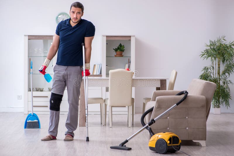 Young Leg Injured Contractor Cleaning the House Stock Image - Image of ...