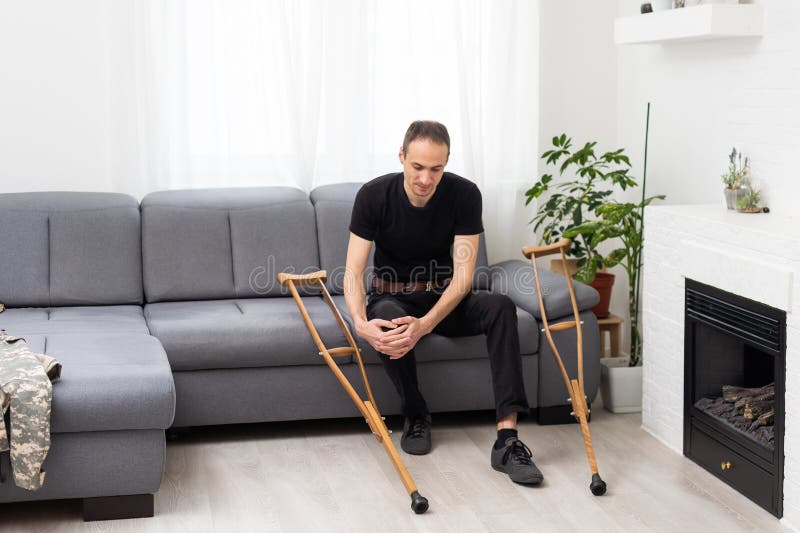 Young Leg Injured Man with Crutches Stock Image - Image of hurt, clinic ...