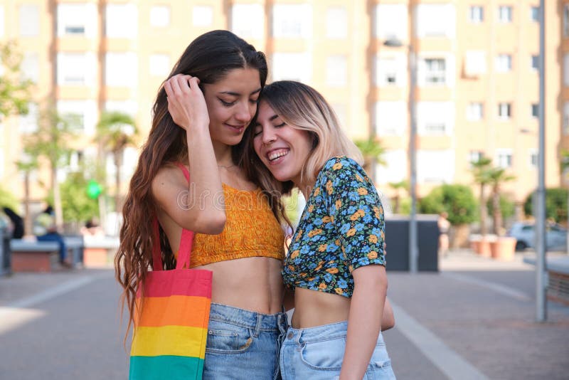 Young Lesbian Couple Hugging And Laughing Outdoors Stock Image Image
