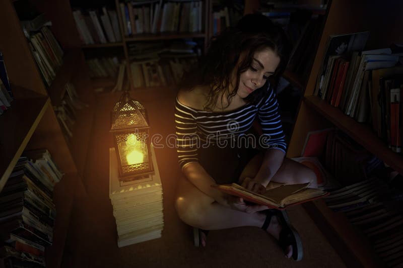 Young Librarian Reading at the Candle Lantern Stock Image - Image of ...